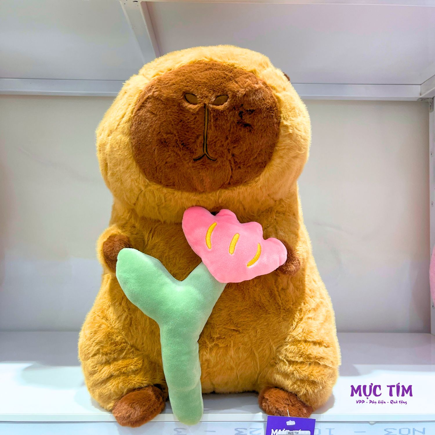 Gấu bông Capybara ôm bông hoa 40cm